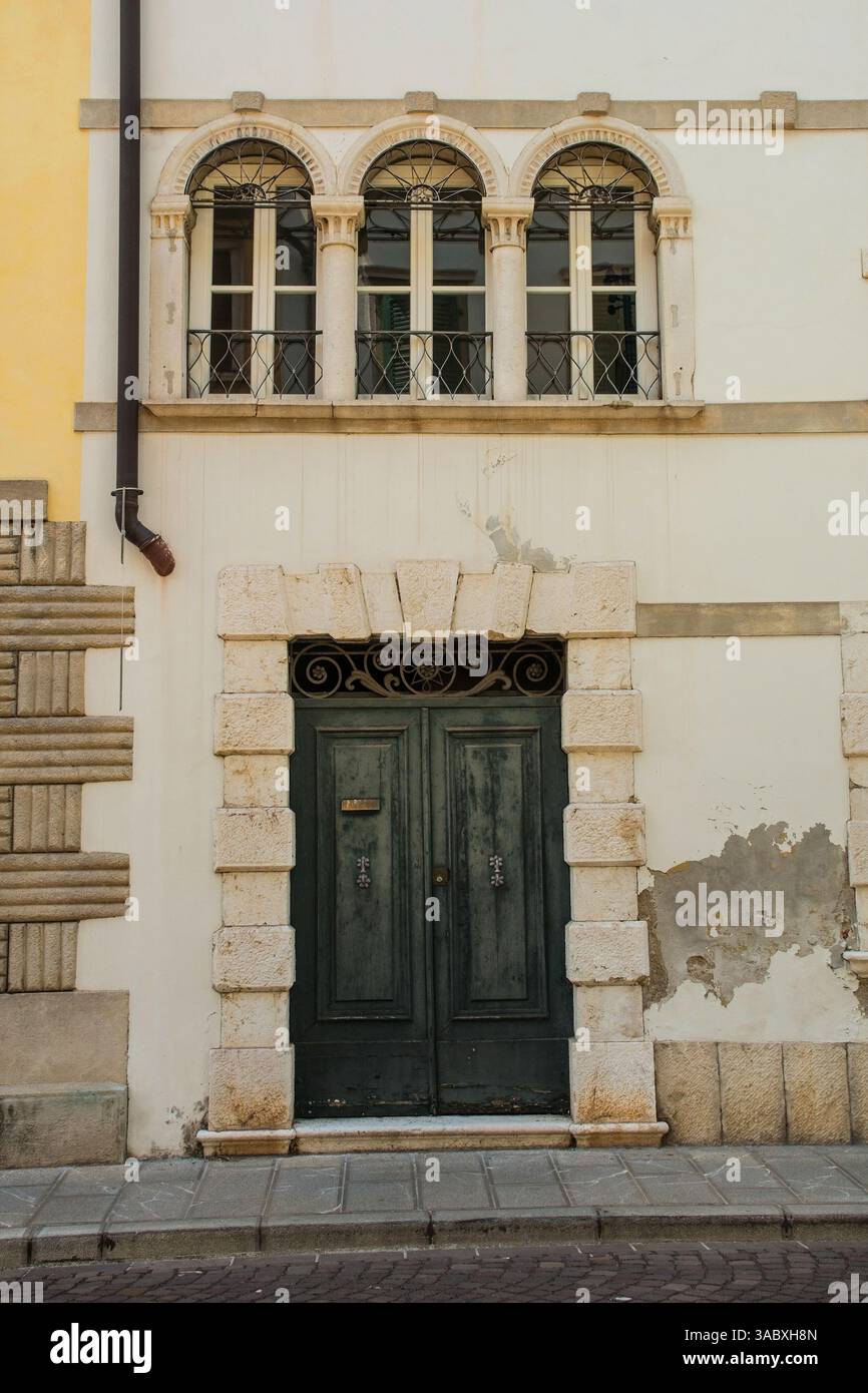 A wooden double door in an historic Venetian Renaissance building in ...