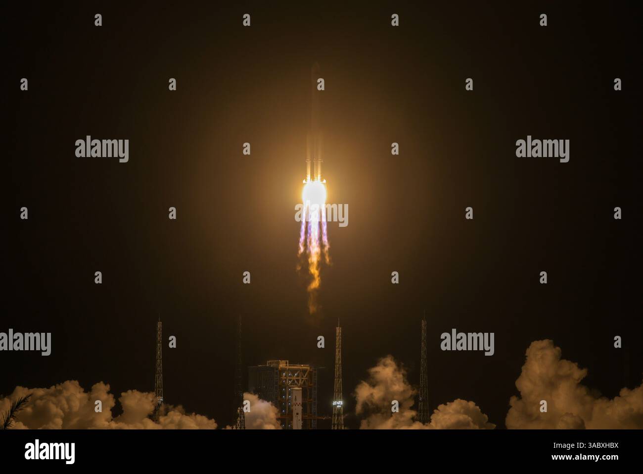 Wenchang,China.30th March 2025. A Long March-7A rocket blasts off from ...