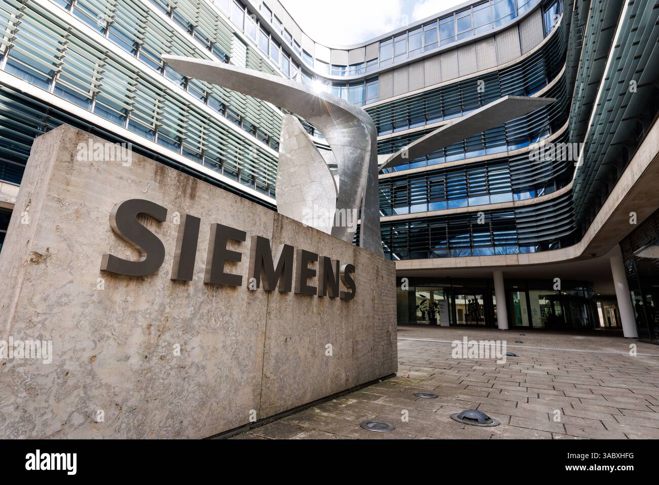 Munich, Germany. 02nd Apr, 2025. The lettering and logo of Siemens AG can be seen on flags in ...
