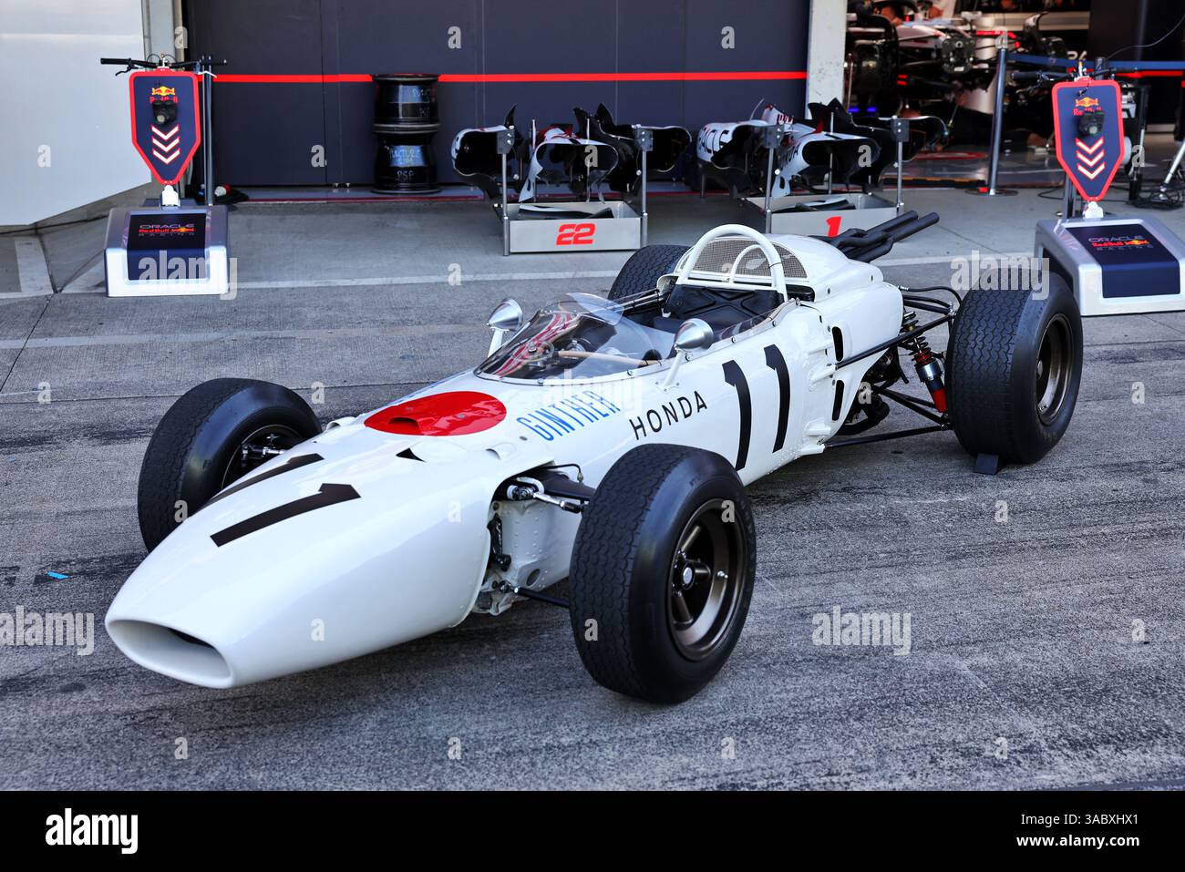 The 1965 Honda RA272 F1 car piloted by Richie Ginther outside the Red Bull Racing pit garages ...