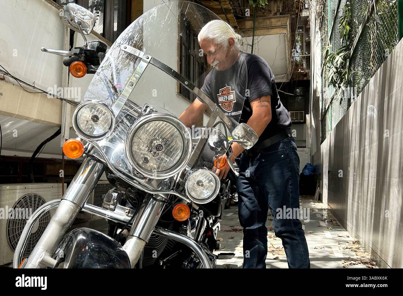 Romesh Sapra, an architect, prepares to ride his Harley Davidson ...