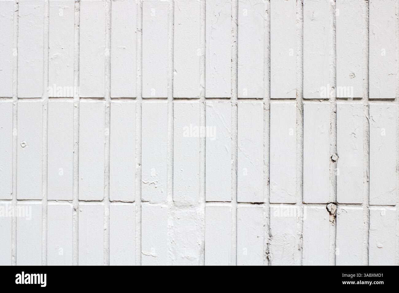 This image features a detailed closeup of a white brick wall that ...