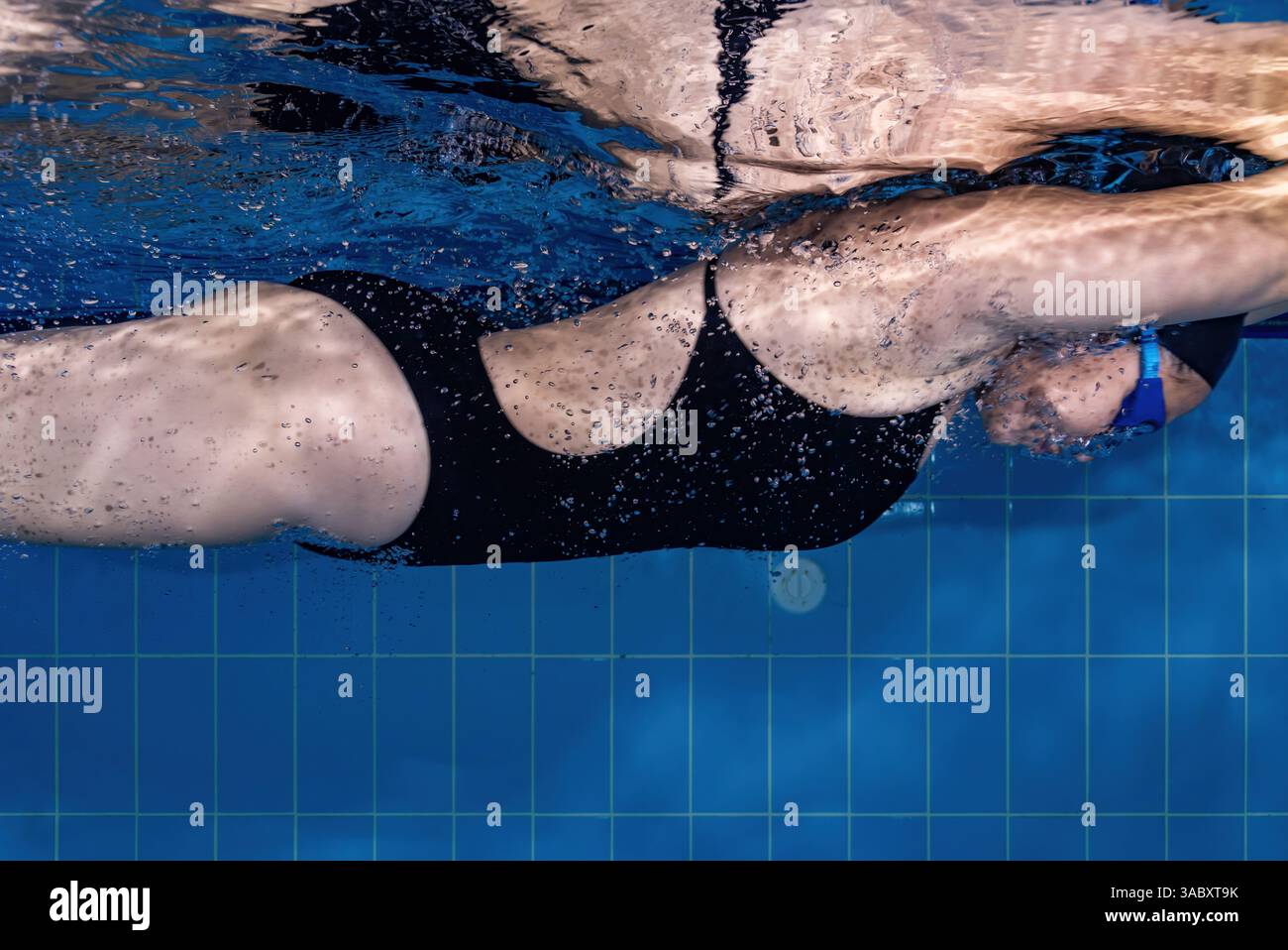 female athlete swimming in a swimming pool, underwater photo Stock ...