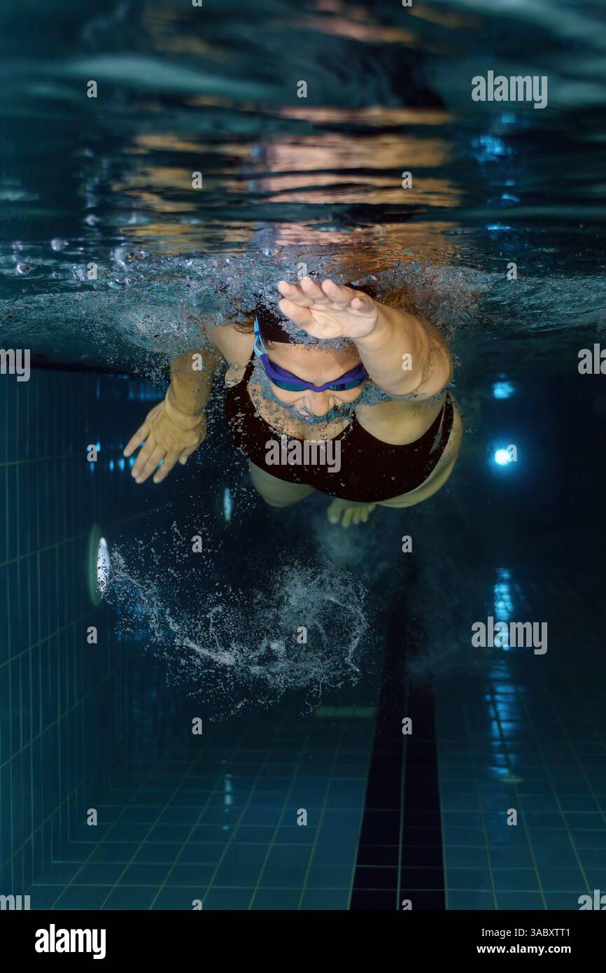 female athlete swimming in a swimming pool, underwater photo Stock ...