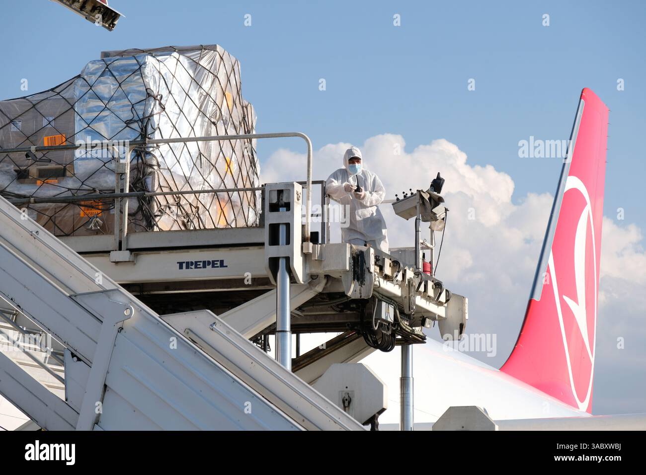 Airport staff and medics unload humanitarian cargo Turkish Cargo Stock ...