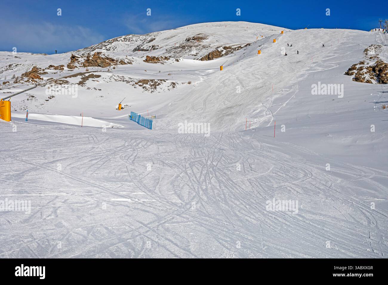 ski red slope with drag lifts. Family active vacation Stock Photo - Alamy
