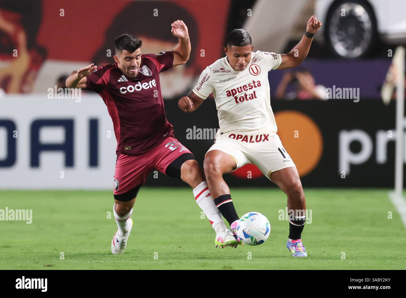 Edison Flores of Universitario de Deportes and Marcos Acuna of River ...