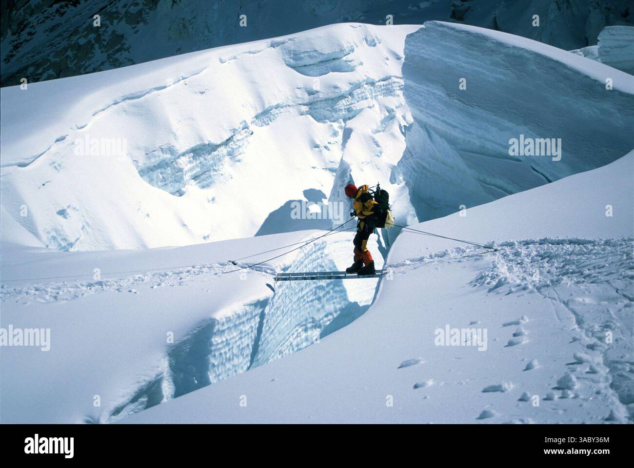 Apr 23, 2002 - Everest Region, Nepal - A climber crossing ladders while ...