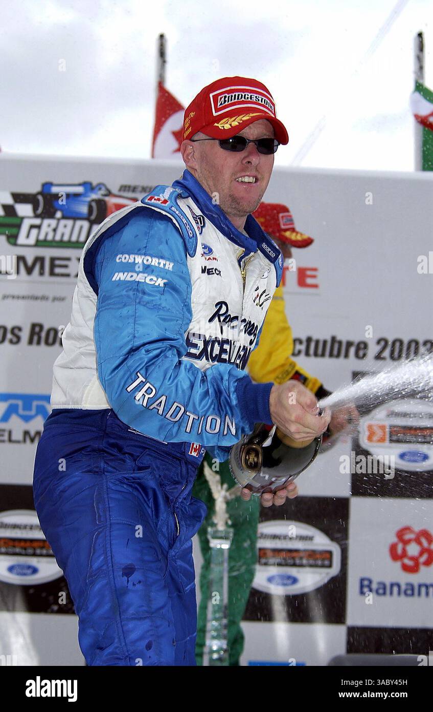 Race winner Paul Tracy (CDN) Forsythe Racing celebrates on the podium ...