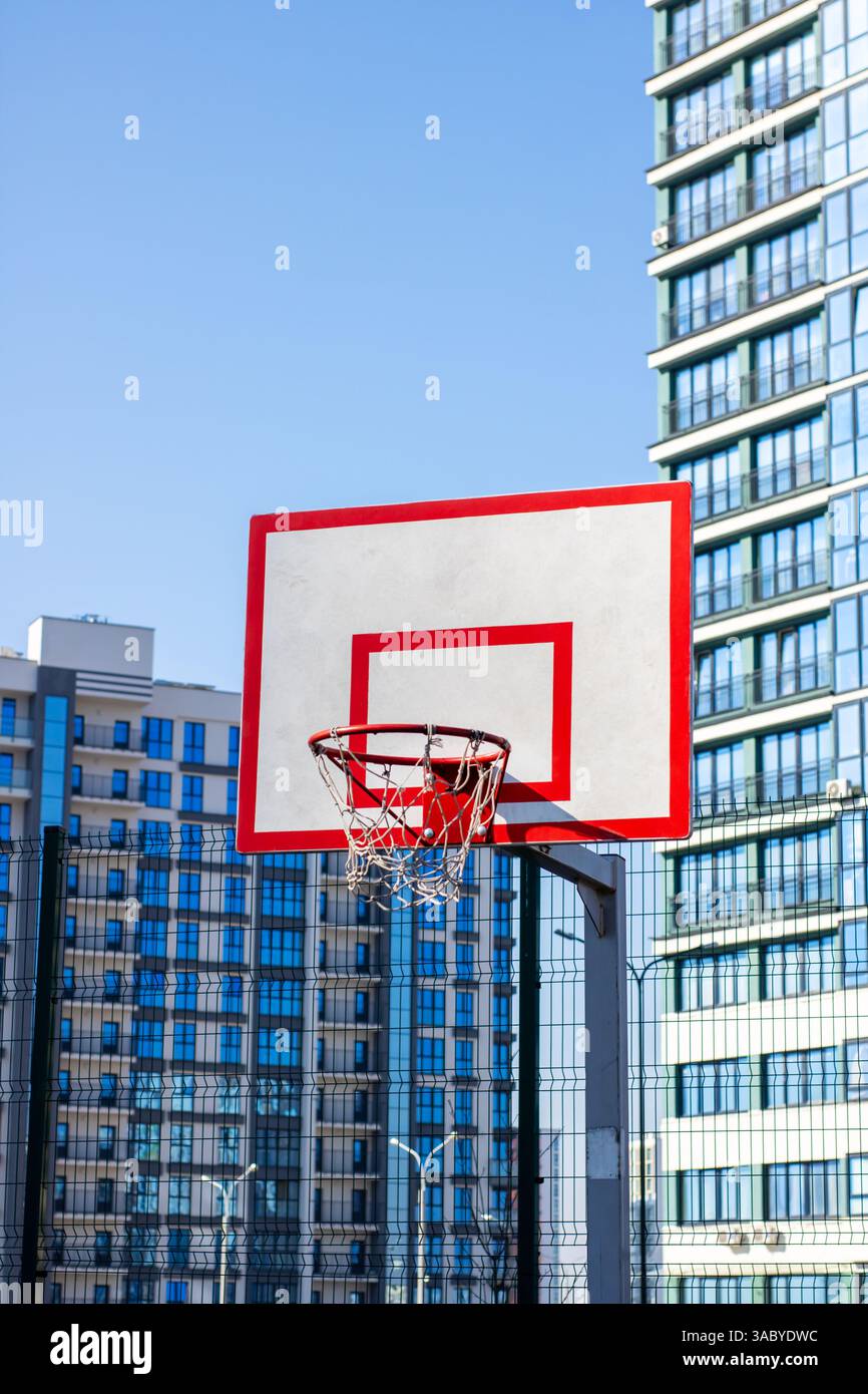 A vibrant and colorful basketball hoop set prominently against a ...
