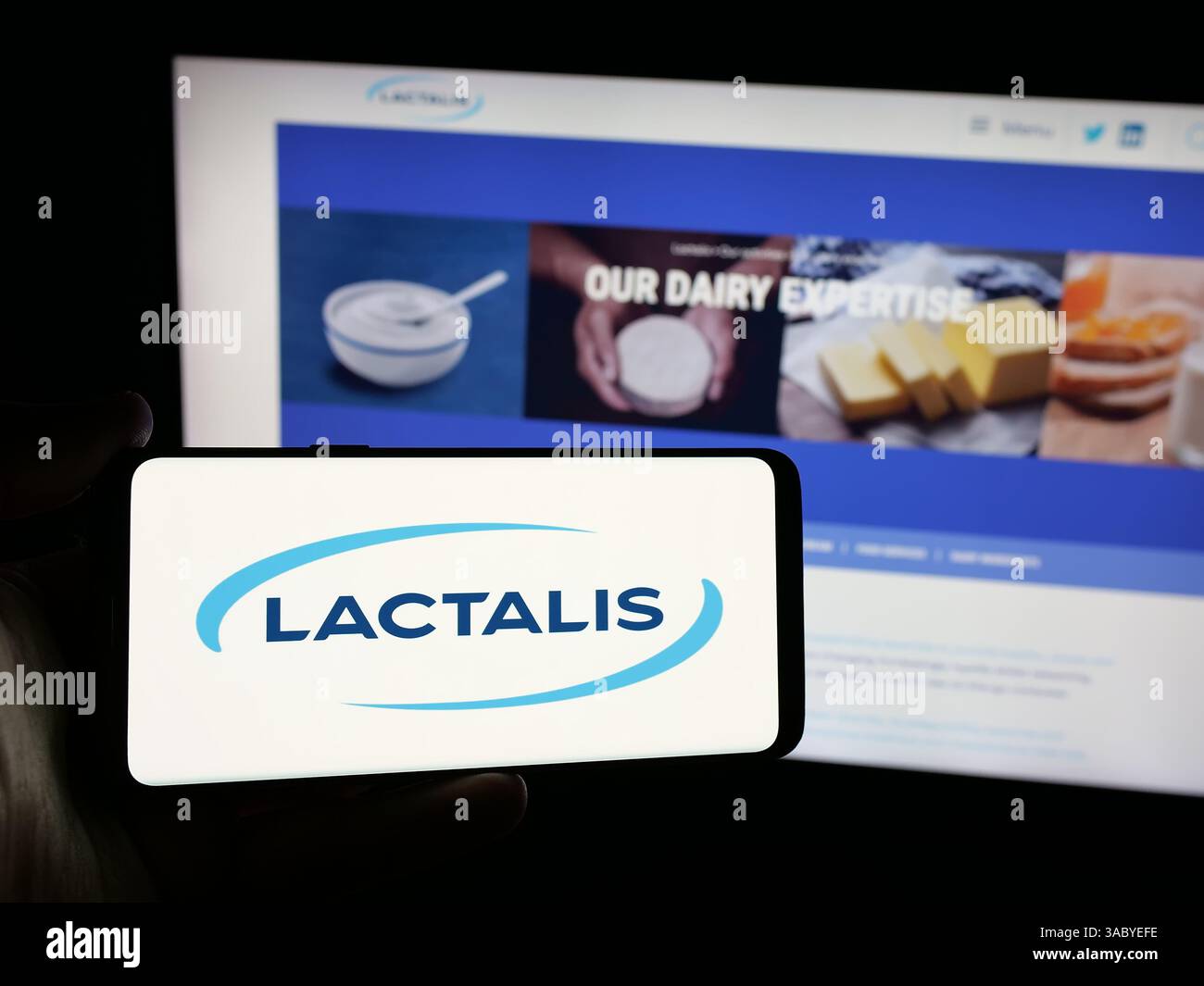 In this photo illustration, a smartphone with the logo of French dairy ...