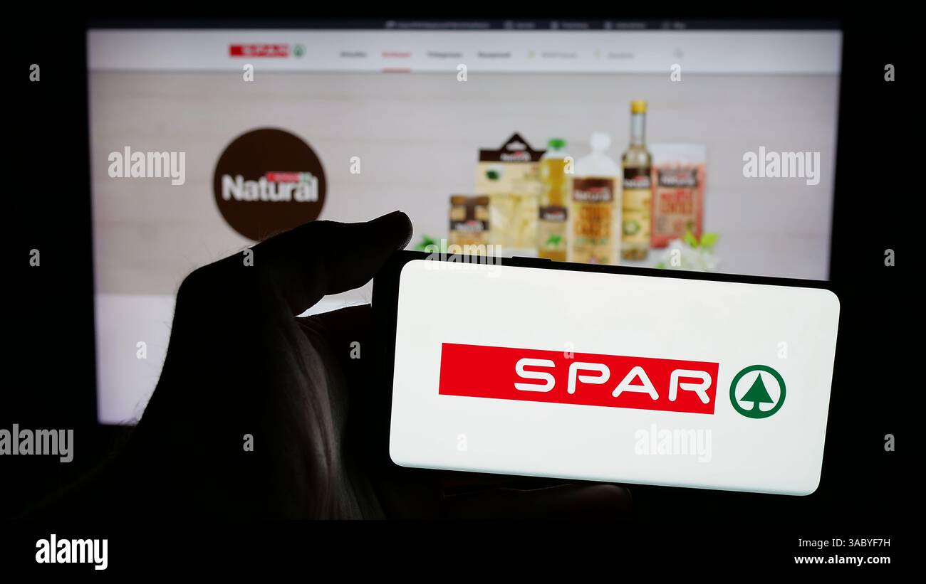 In this photo illustration, a mobile phone with the logo of Swiss ...