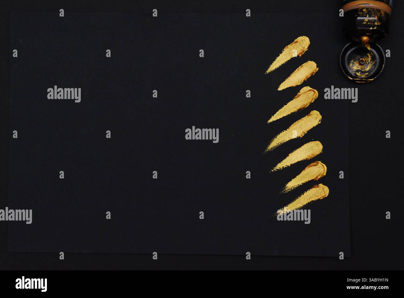 a large sheet of watercolor paper and a drop of blue pain Stock Photo ...