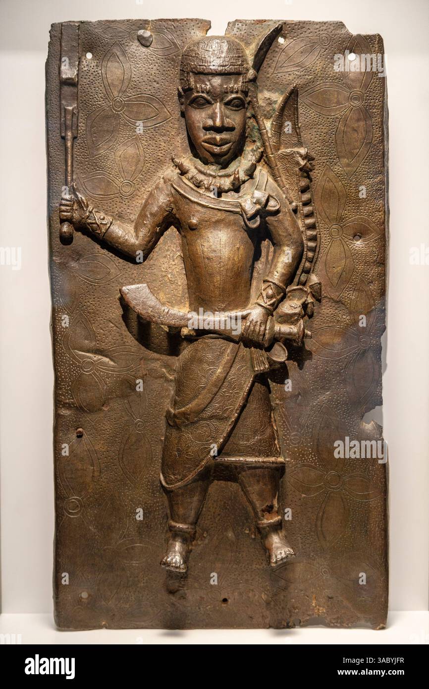 Decorative plaque with an armed high dignitary, ancient Benin Kingdom ...
