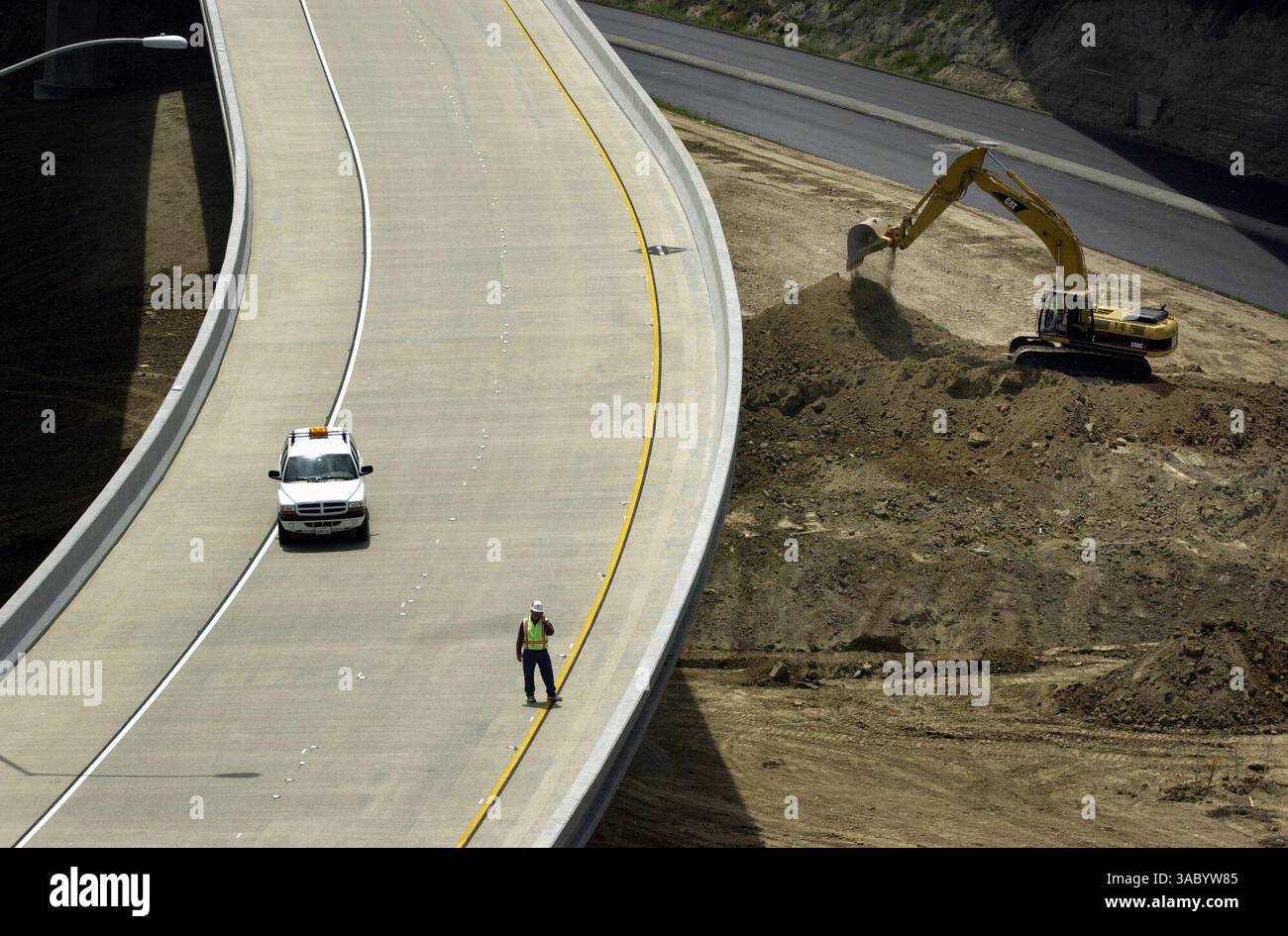 (Published 05/07/2003, B-4:1,6; B-3:7) A CalTrans worker stood on one ...