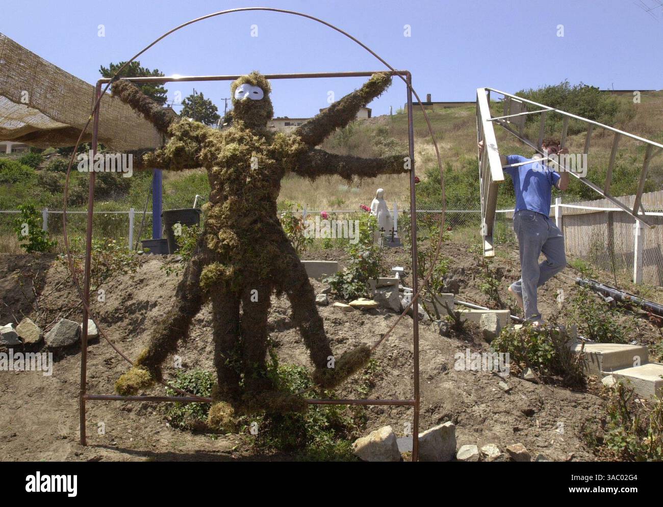 (published 07/03/2003, NC-1, NI-1) Karl langer carries a ladder through ...