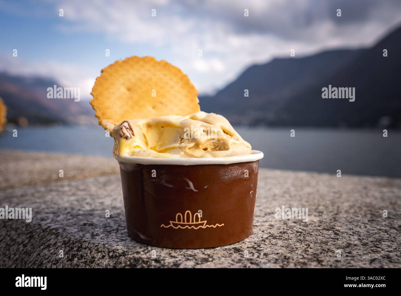 Cup of Gelato with Waffle Biscuit by Lake Como's Serene Waters Stock ...