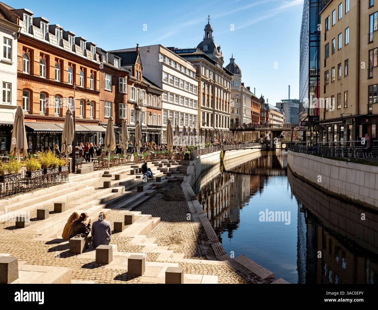 People enjoying the sun and the atmosphere in downtown Aarhus Stock ...
