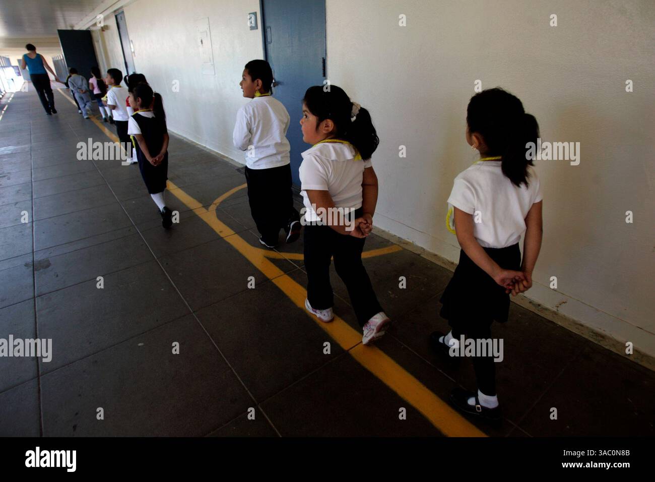 (Published 12/25/2005, N-3) Isaac Morales, 5, left, Nancy Fabian, 4 ...