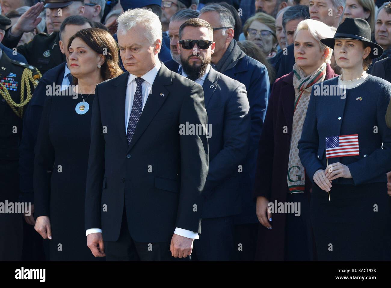 Lithuania's President Gitanas Nauseda, front, attends a solemn farewell ...