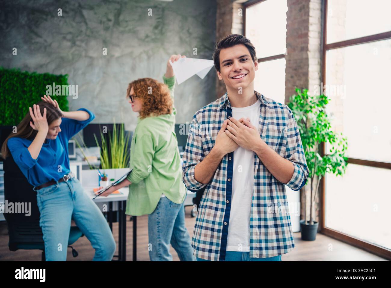 Young professionals in a coworking space showcasing teamwork and a ...