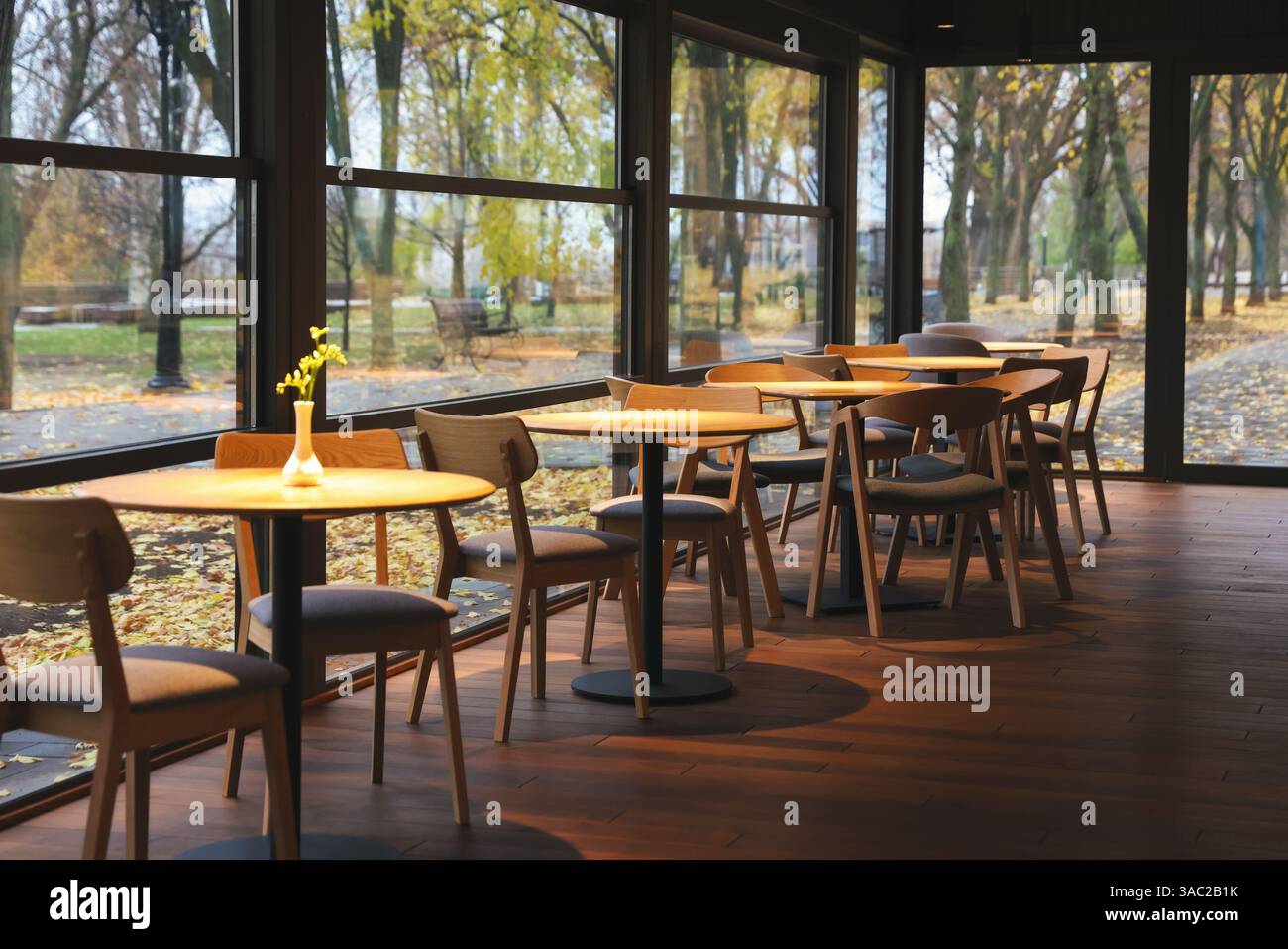 Stylish restaurant with large windows and comfortable furniture ...