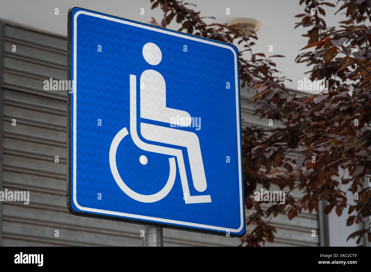 Blue Disabled parking sign in parking lot for people with a disability ...