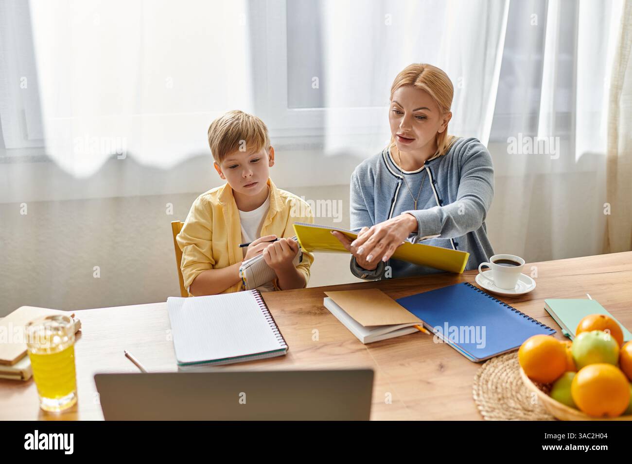 Bonding moment as a mother helps her son explore new ideas while ...