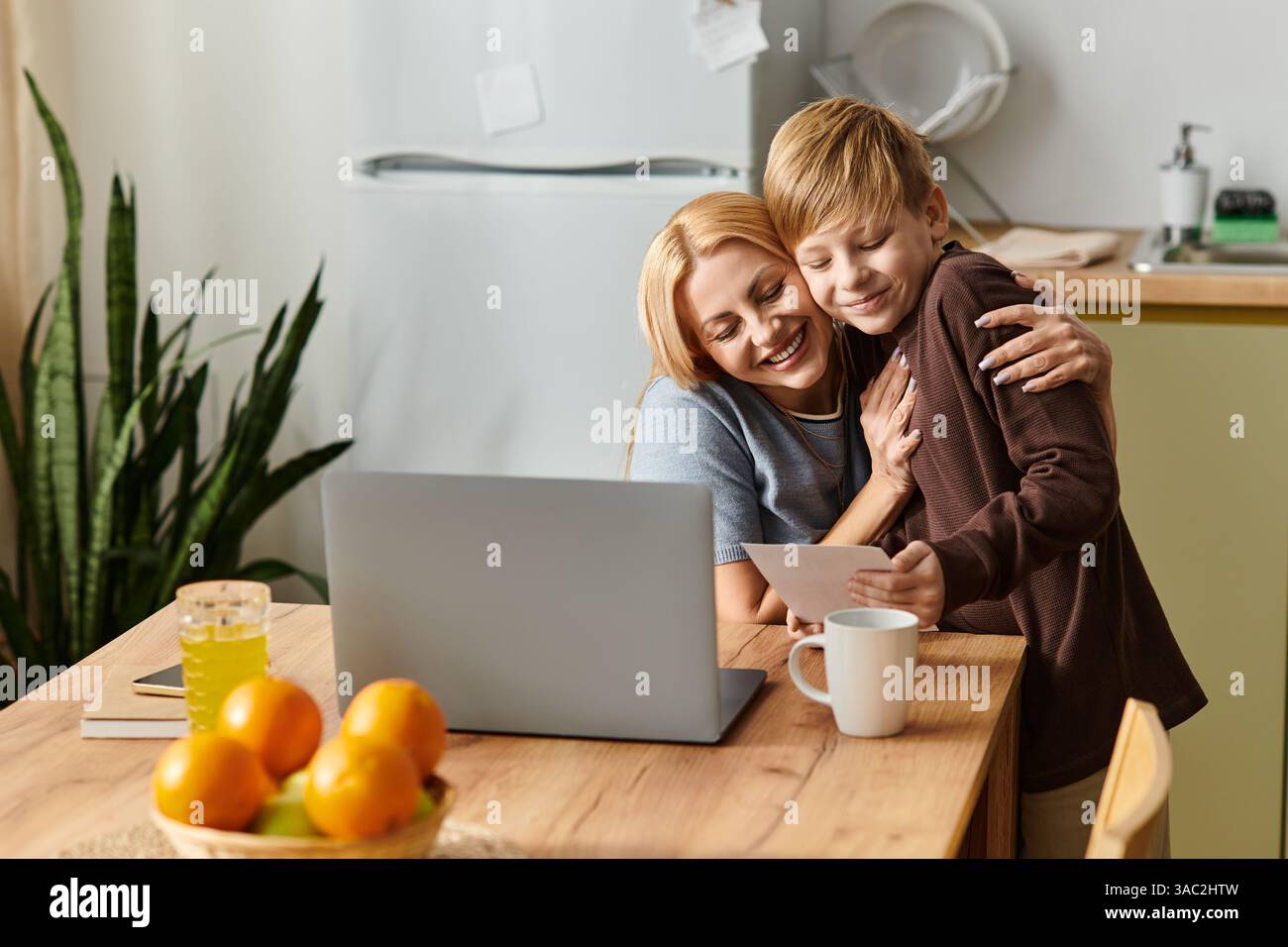 A mother and son share a special moment enjoying a fun activity at home ...