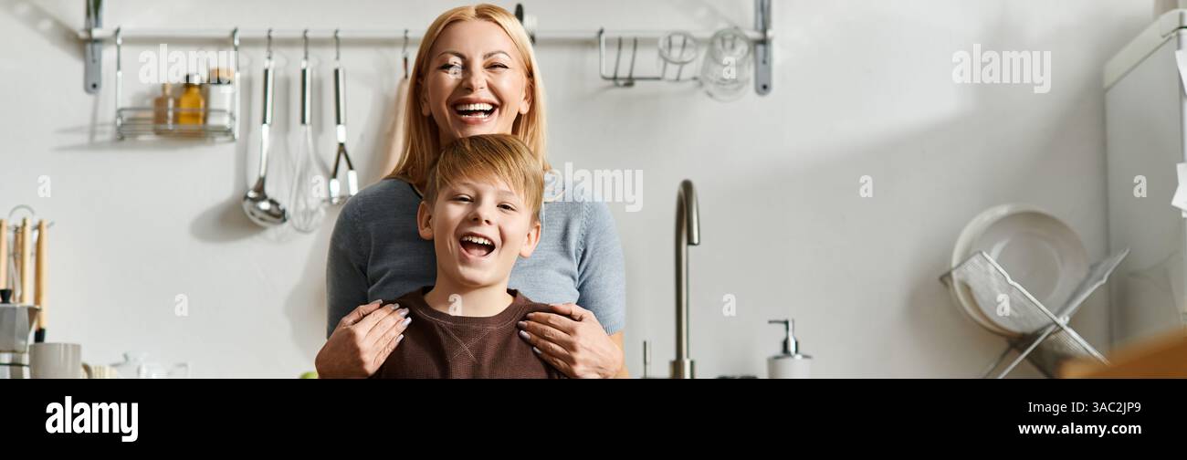 Bright kitchen fills with joy as mother embraces her son, both sharing ...