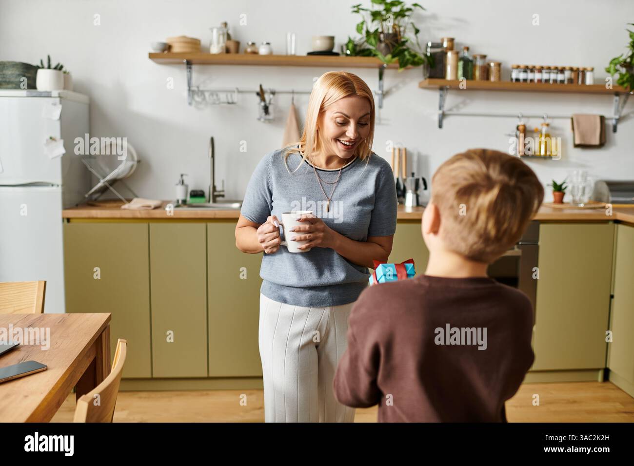 A mother happily connects with her son over a surprise gift in their ...