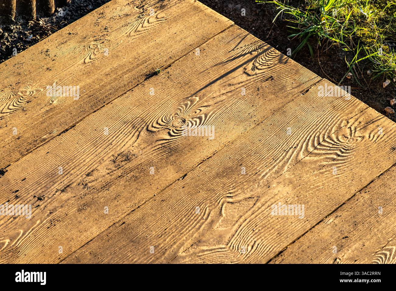 Stone slabs resembling wooden planks on the terrace, laying the floor ...