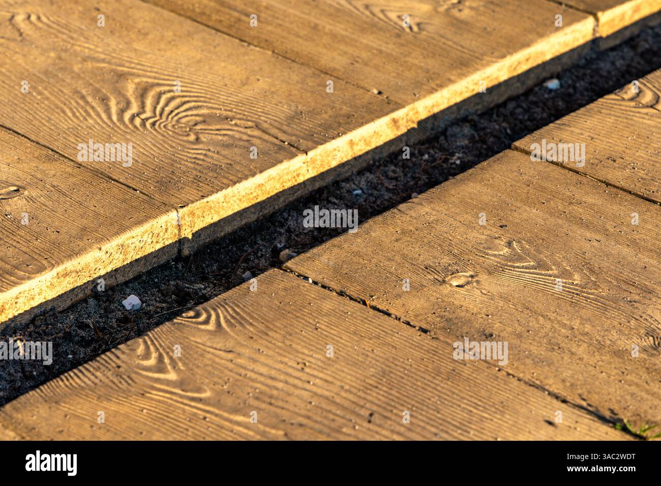 Stone slabs resembling wooden planks on the terrace, laying the floor ...
