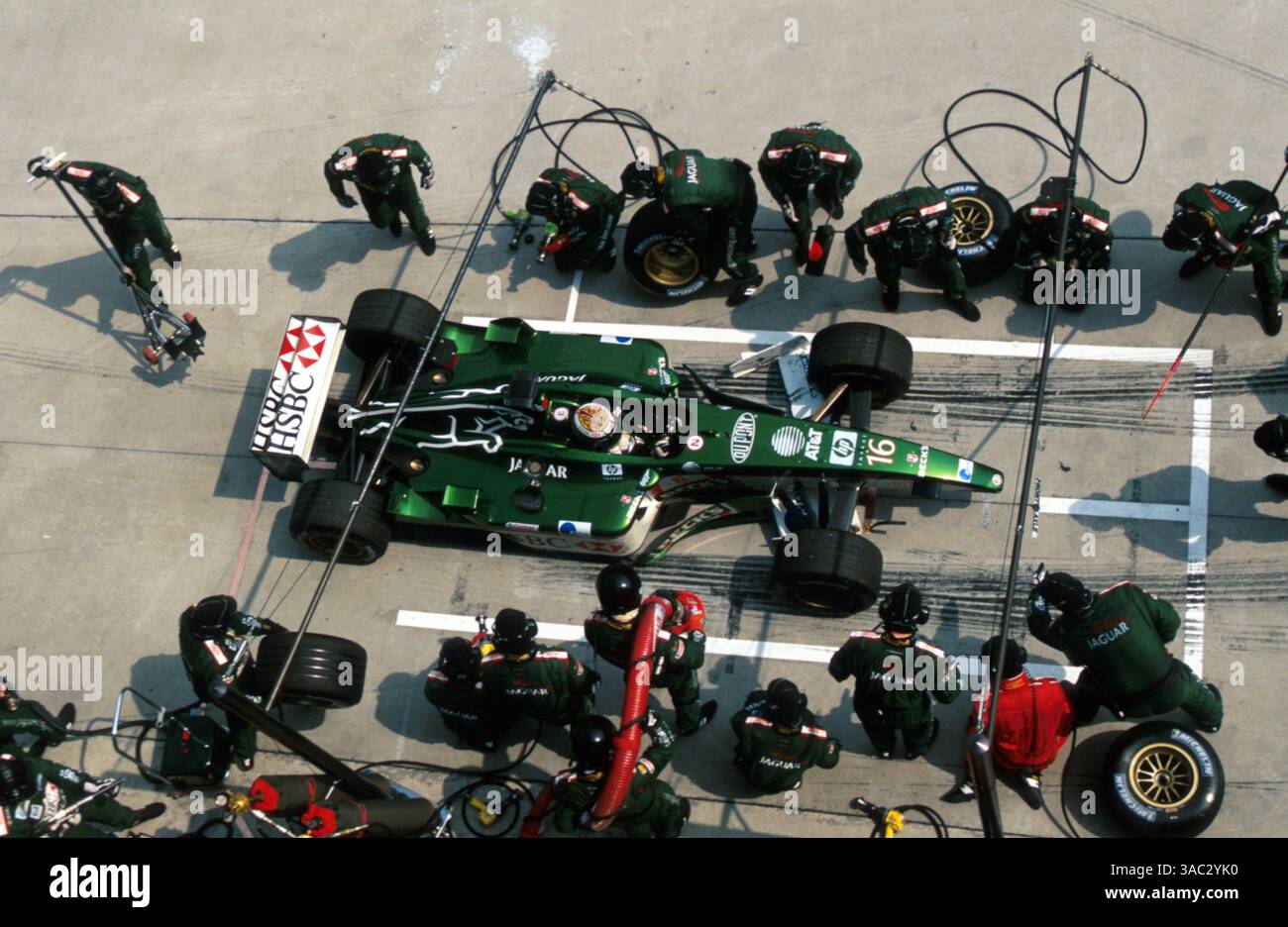 A pit stop to replace the front nose cone on the Jaguar R3 of Eddie ...
