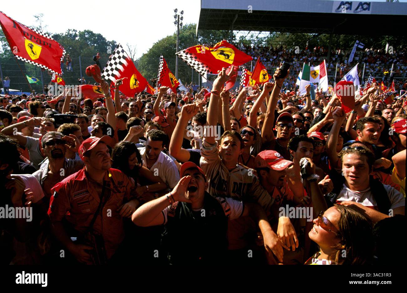The fans in the crowds waved their flags enthusiatically..Formula One ...