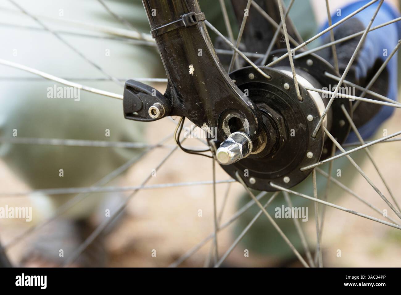 Technician examines wheel bicycle bicycle hi-res stock photography and ...