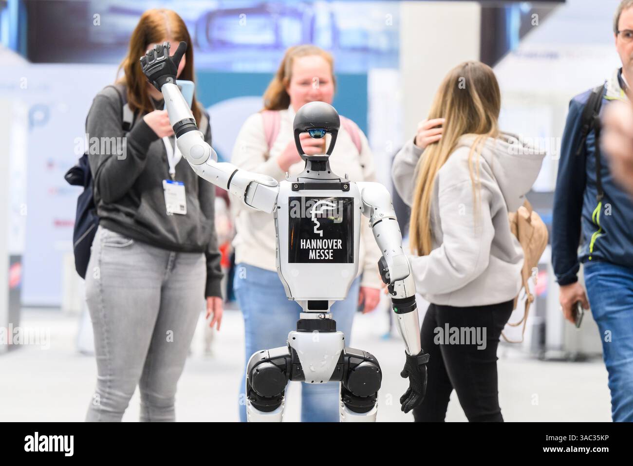Hanover, Germany. 03rd Apr, 2025. A robot from MyBot Shop with the trade fair logo welcomes ...