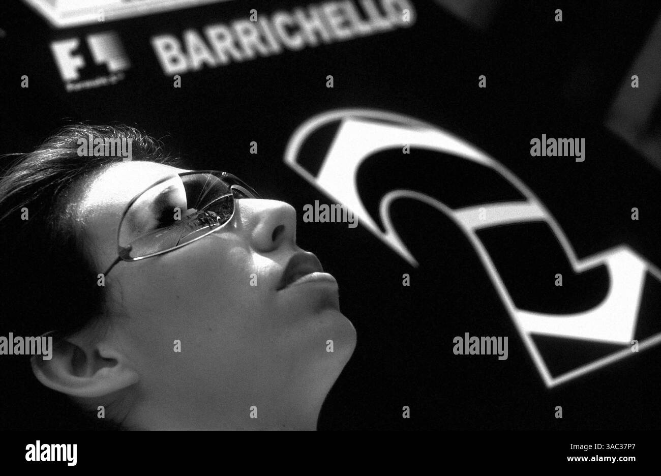 Rubens Barrichello's (BRA), Ferrari, grid girl displays his board ...