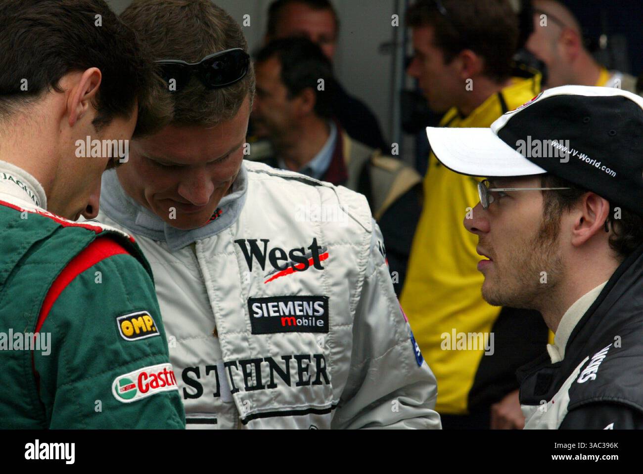 L to R): Mark Webber (AUS) Jaguar, David Coulthard (GBR) McLaren and ...