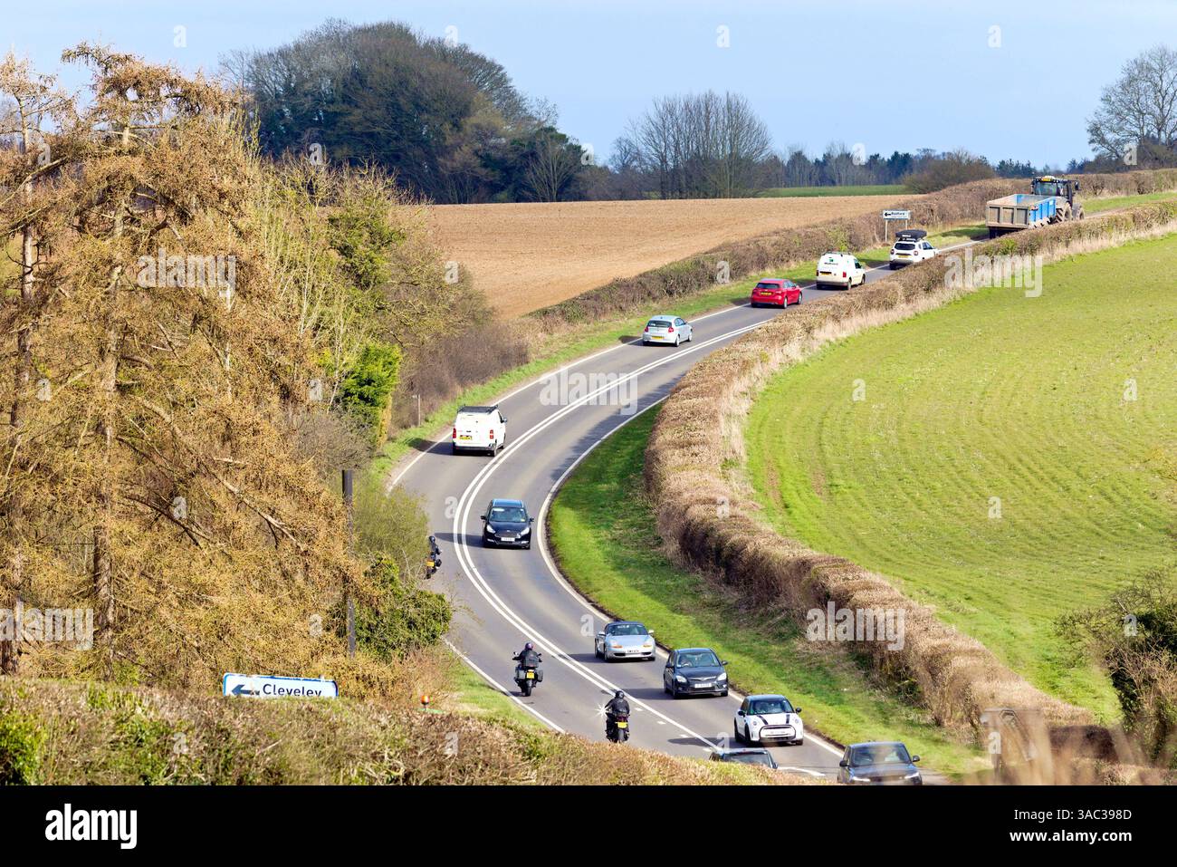 Queues of cars and motorbikes behind farm traffic on A44 Stock Photo ...