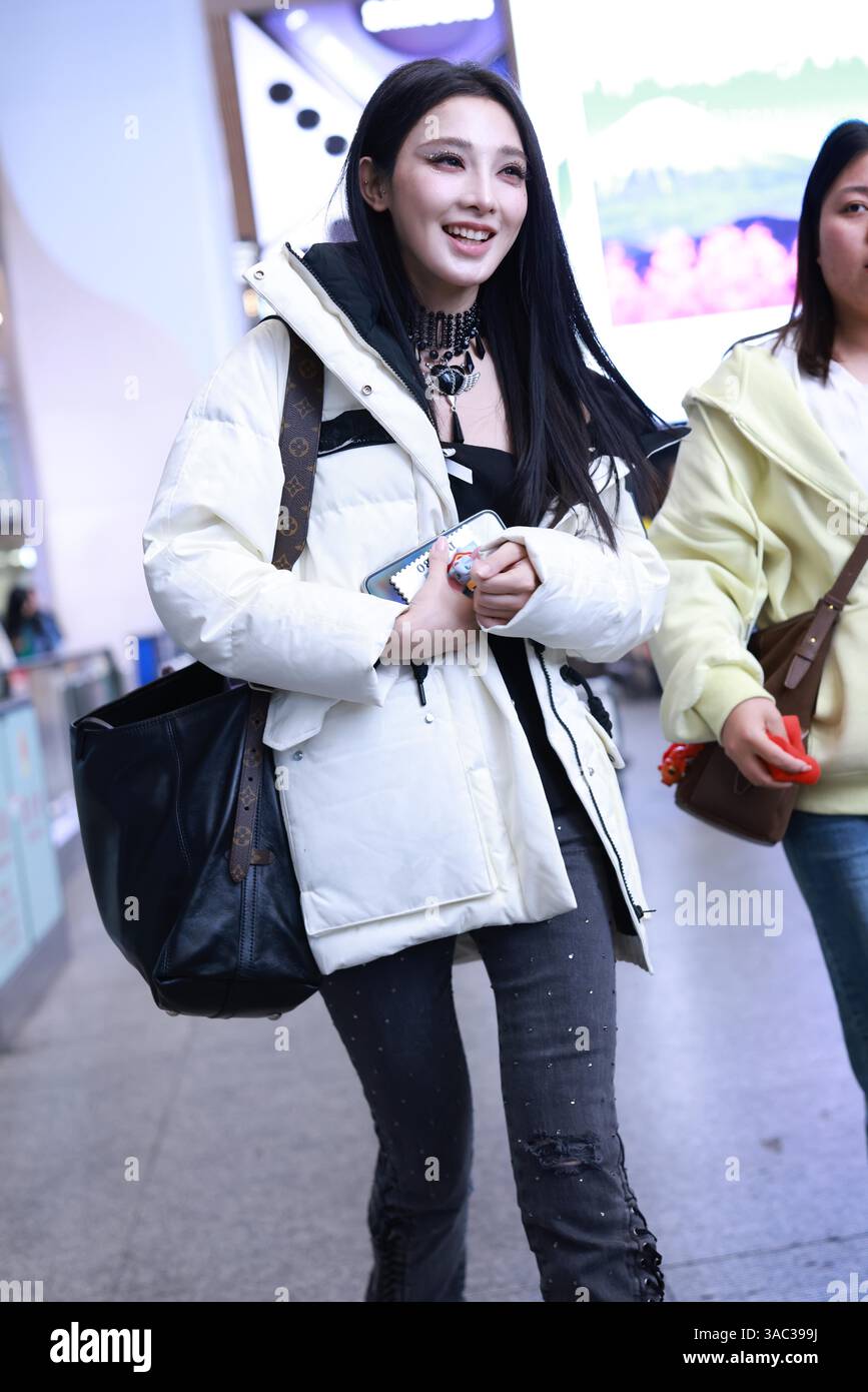 Chinese actress and host Peng Xiaoran appears at the airport in Beijing ...