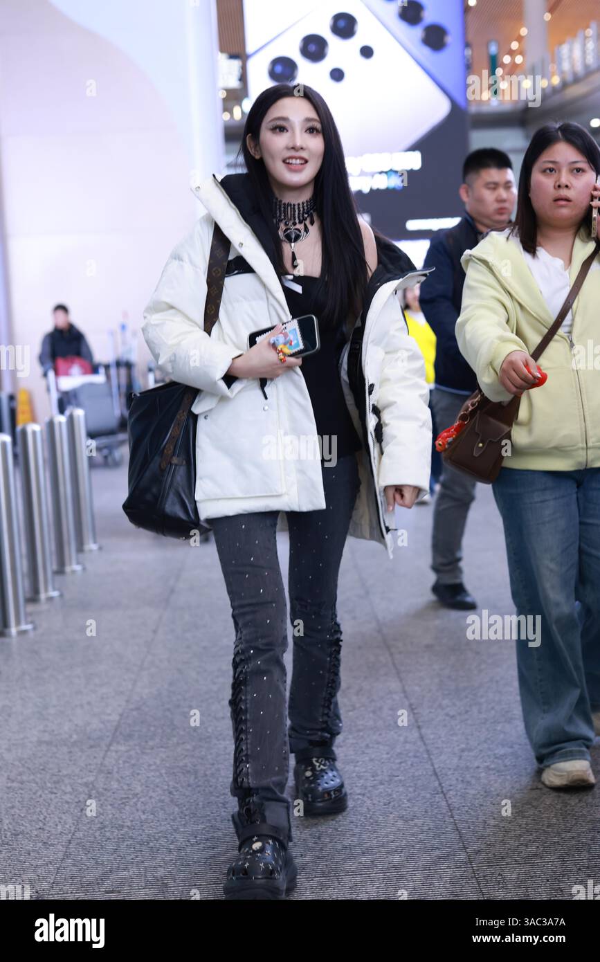 Chinese actress and host Peng Xiaoran appears at the airport in Beijing ...