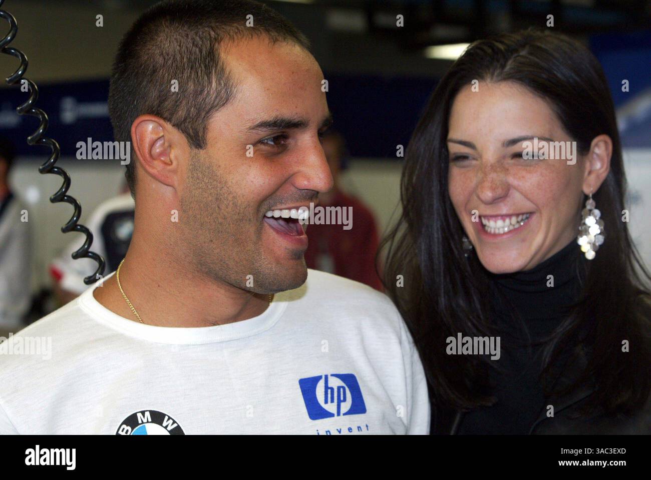 L to R): Juan Pablo Montoya (COL) Williams shares a joke with his wife ...