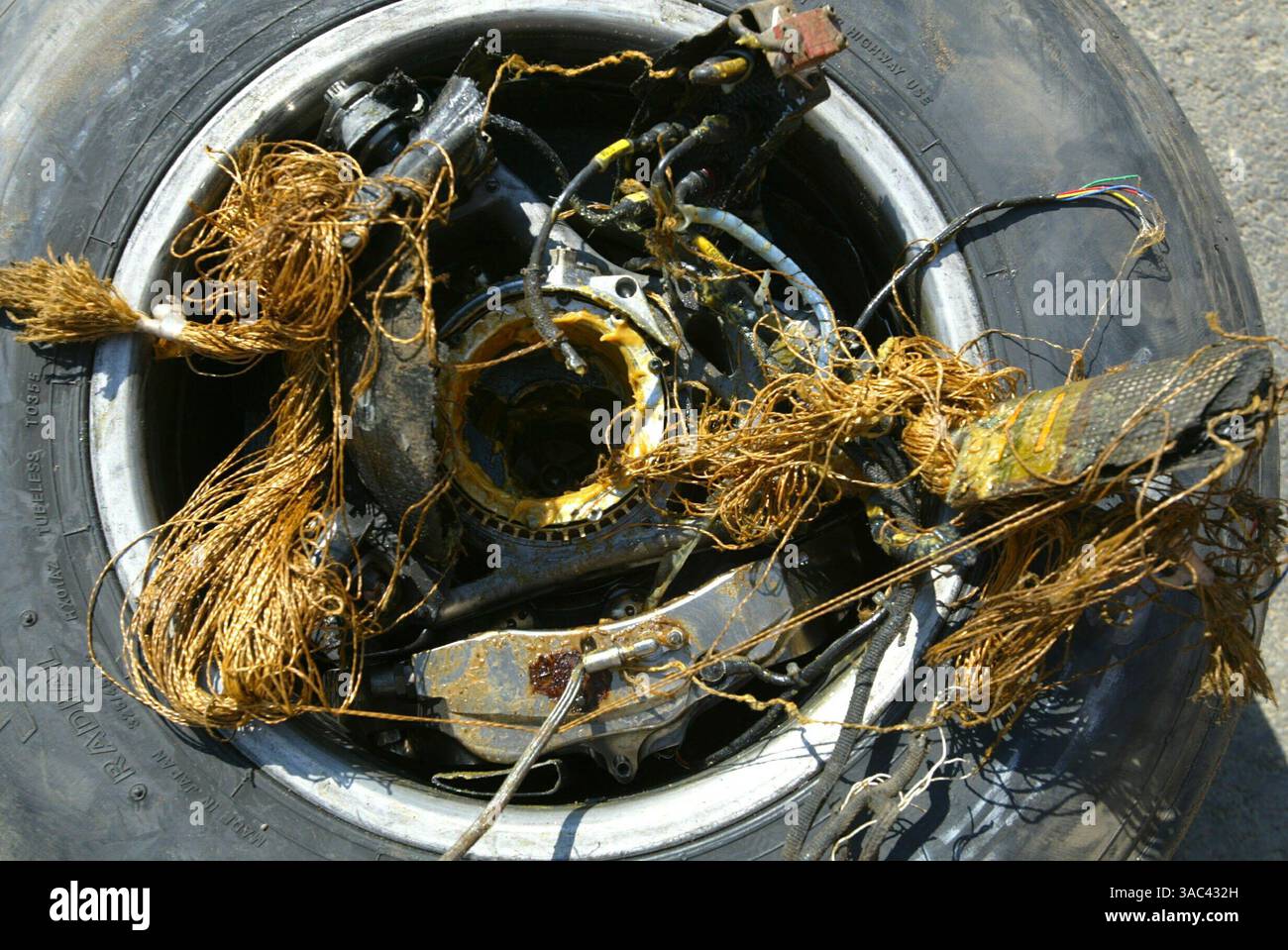 The wheel of Rubens Barrichello (BRA) Ferrari F2003-GA that was ripped ...