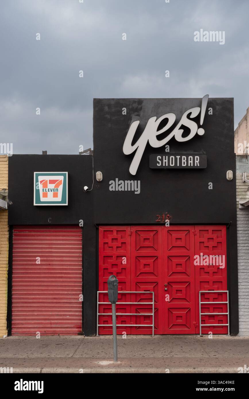 Exterior of Yes! Shot Bar with large bright red doors, downtown McAllen ...
