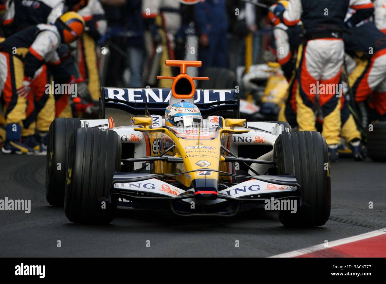 Fernando Alonso (ESP) Renault R28 makes a pit stop...Formula One ...