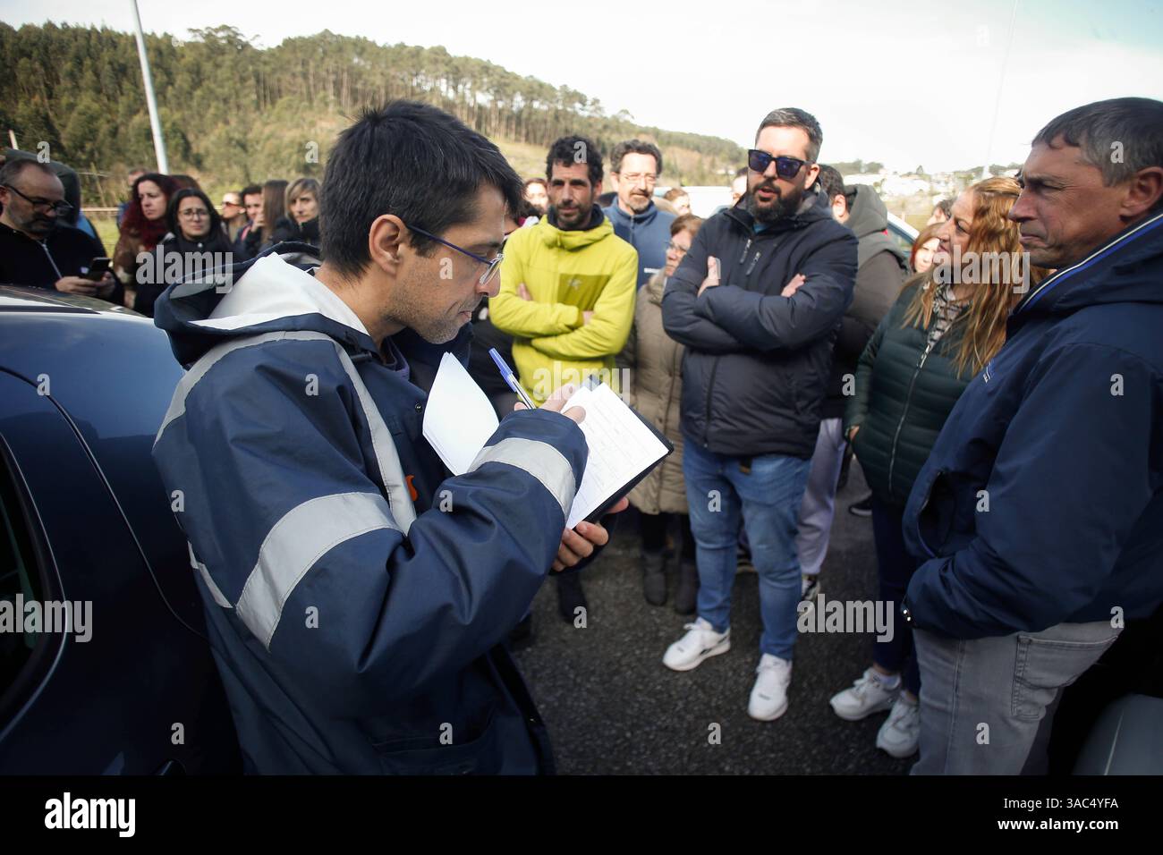 An inspector next to workers at the Sargadelos ceramics factory, who ...