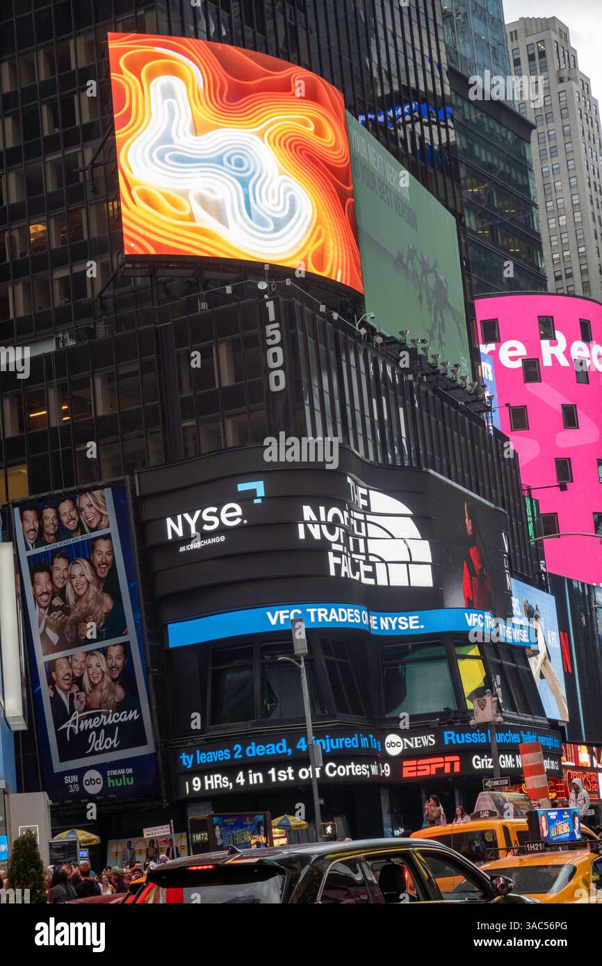 Times Square is brightly lit with electronic billboards, New York City ...