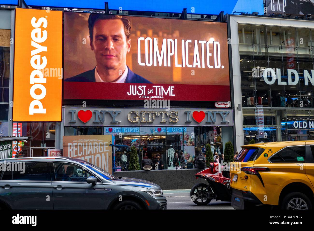 Times Square is brightly lit with electronic billboards, New York City ...