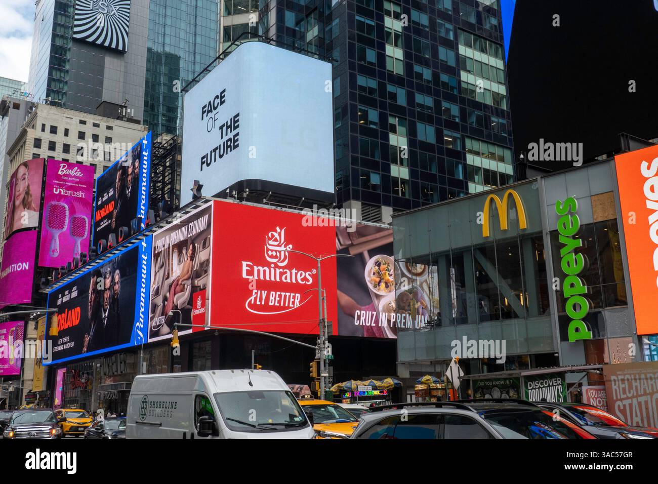 Times Square is brightly lit with electronic billboards, New York City ...